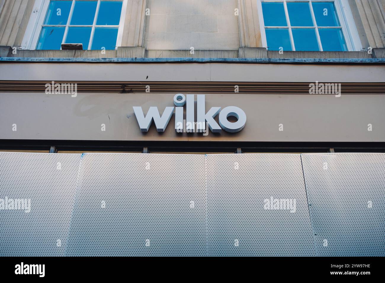 Wilko high street Storefront of a closed retail location with metal ...