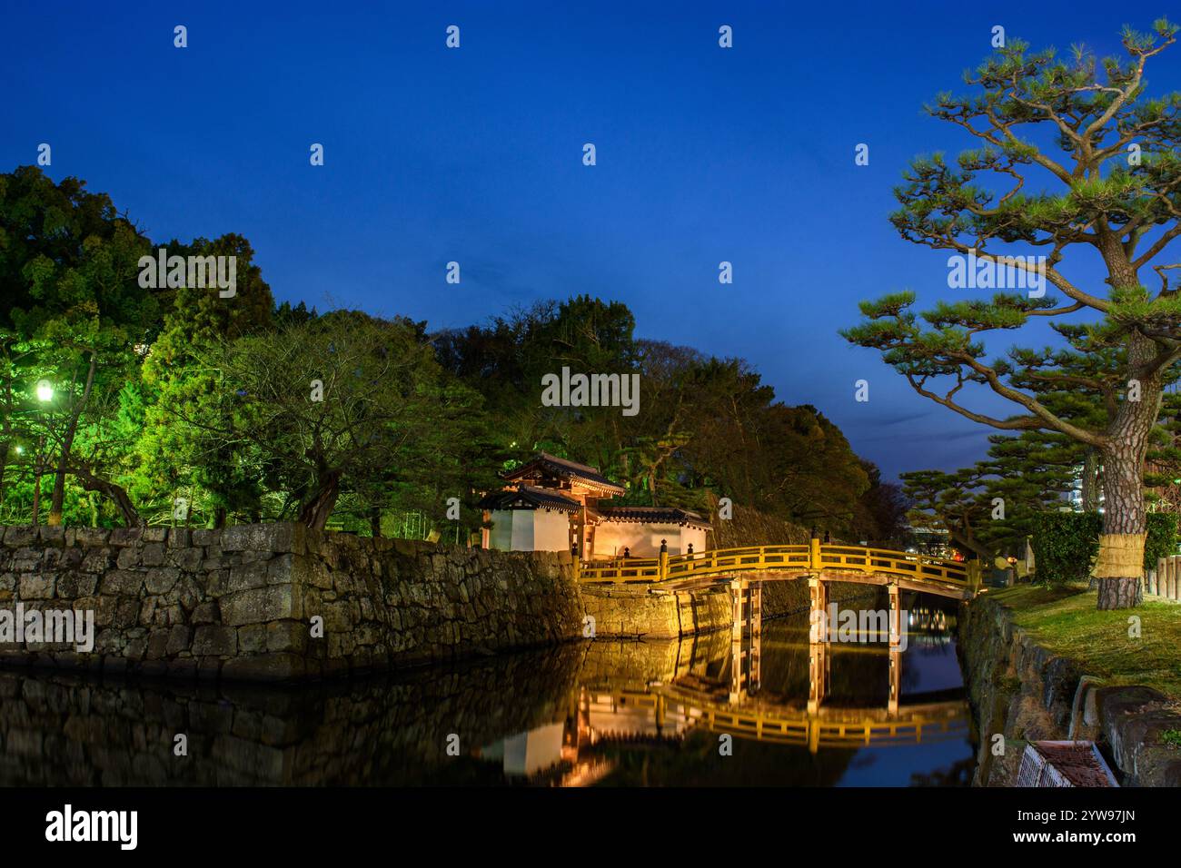 Bridge over water moat at the entrance of Wakayama castle, old historic ...