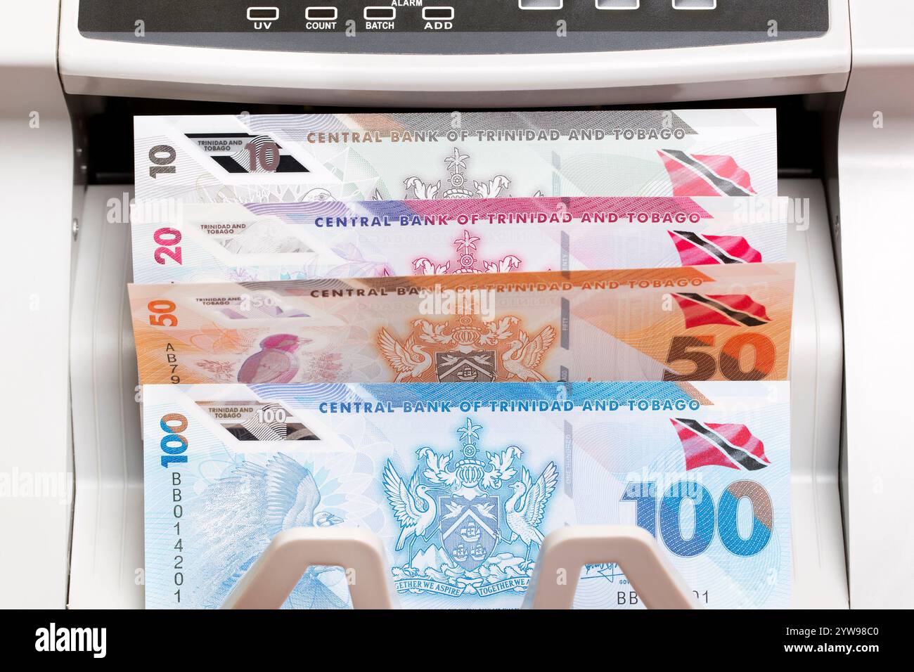 Trinidad and Tobago money - dollar in the counting machine Stock Photo ...