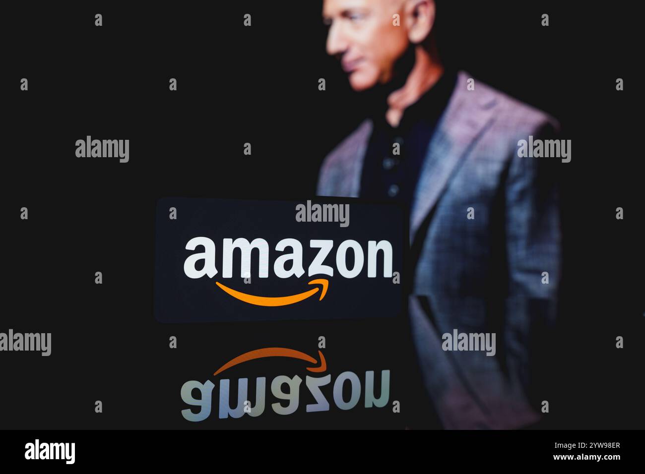 Amazon logo and Jeff Bezos in the background. December 6, 2024 Stock ...