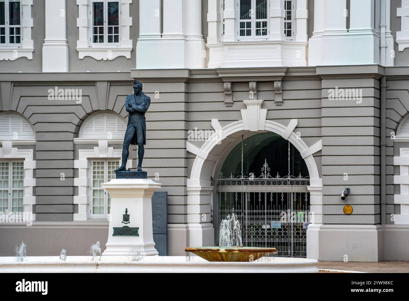 A statue of Stamford Raffles by T. Woolner stands at the front of the The Victoria Theatre and ...