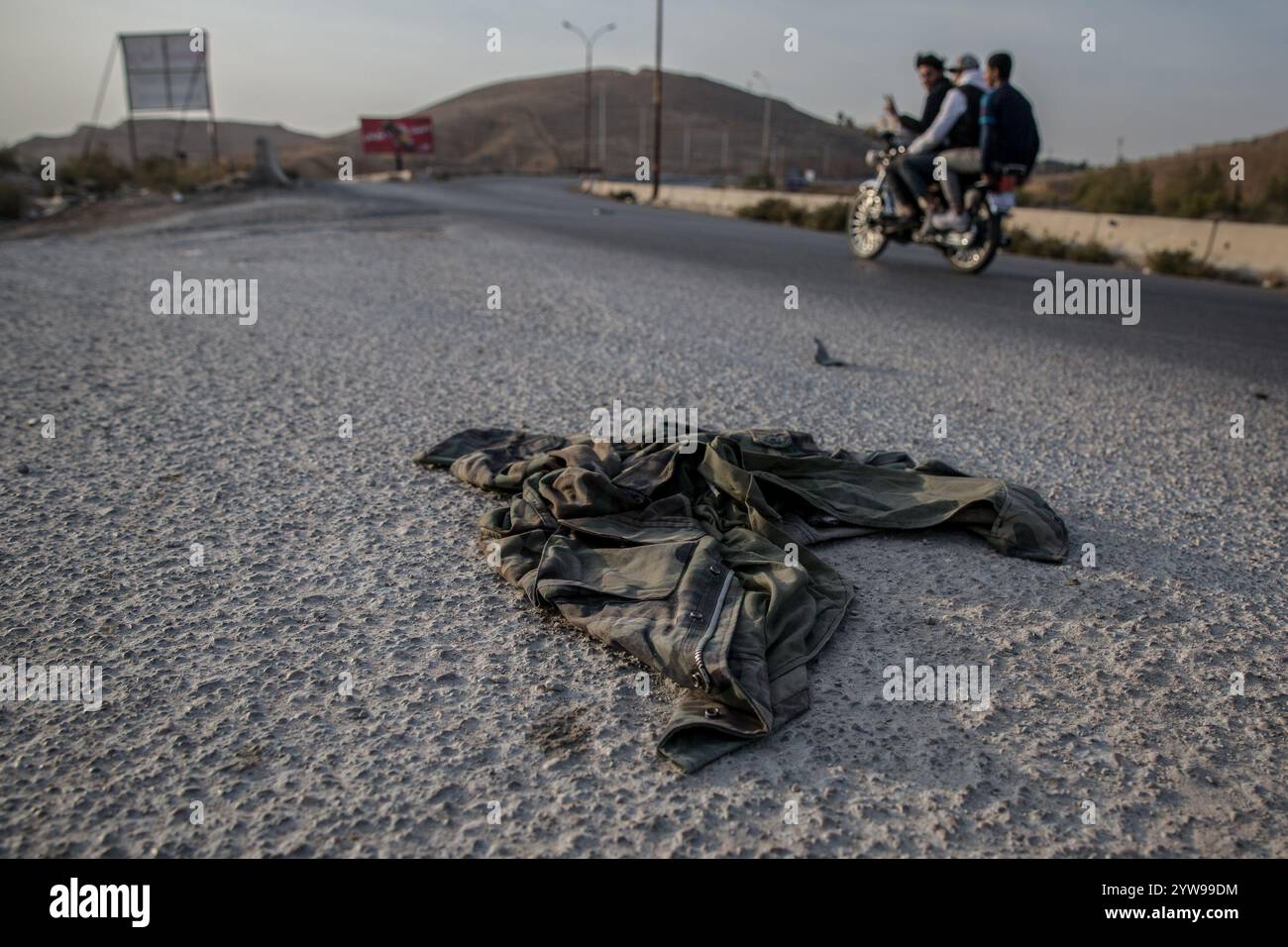 Abandoned military uniforms on a road outside Damascus following the ...