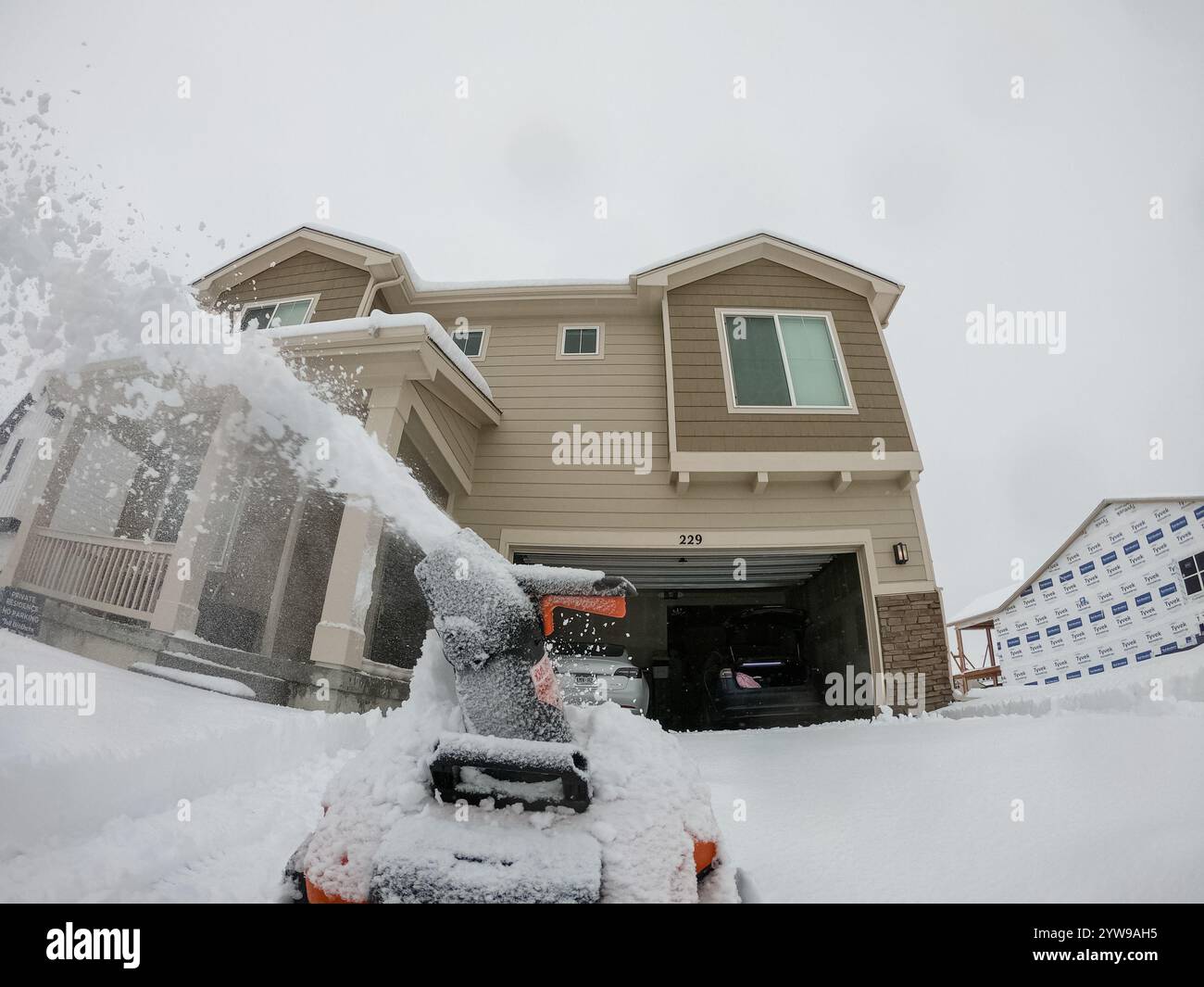 Winter's Embrace with a Snow-Covered Neighborhood Scene Stock Photo - Alamy