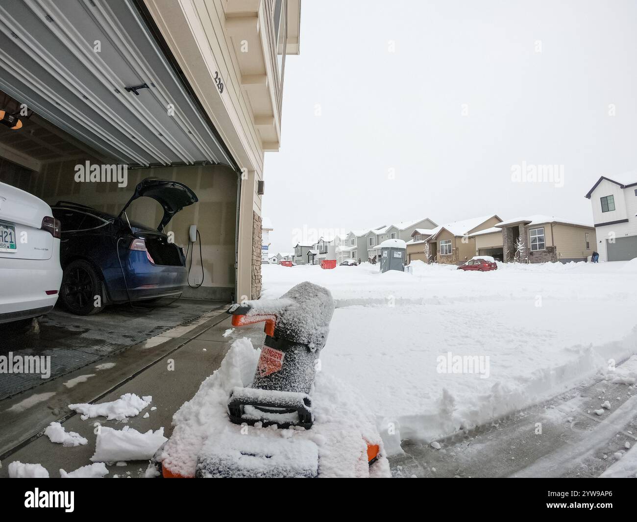 Winter's Embrace with a Snow-Covered Neighborhood Scene Stock Photo - Alamy
