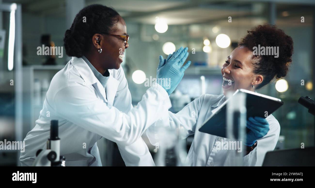 Scientist, women and high five with tablet for biochemistry, experiment ...
