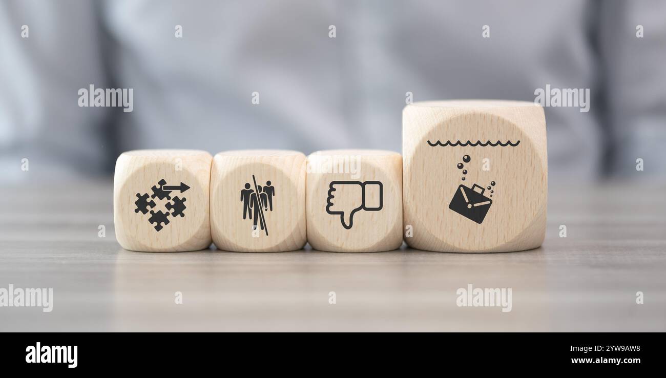 Wooden blocks with symbol of job loss concept Stock Photo - Alamy