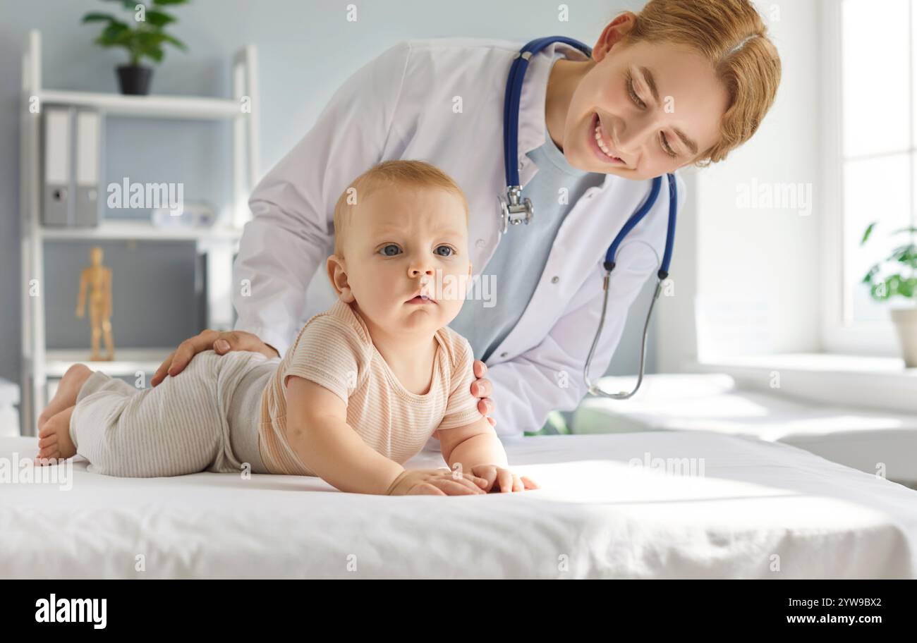 Newborn holding head up, happy pediatrician medical doctor doing exam ...