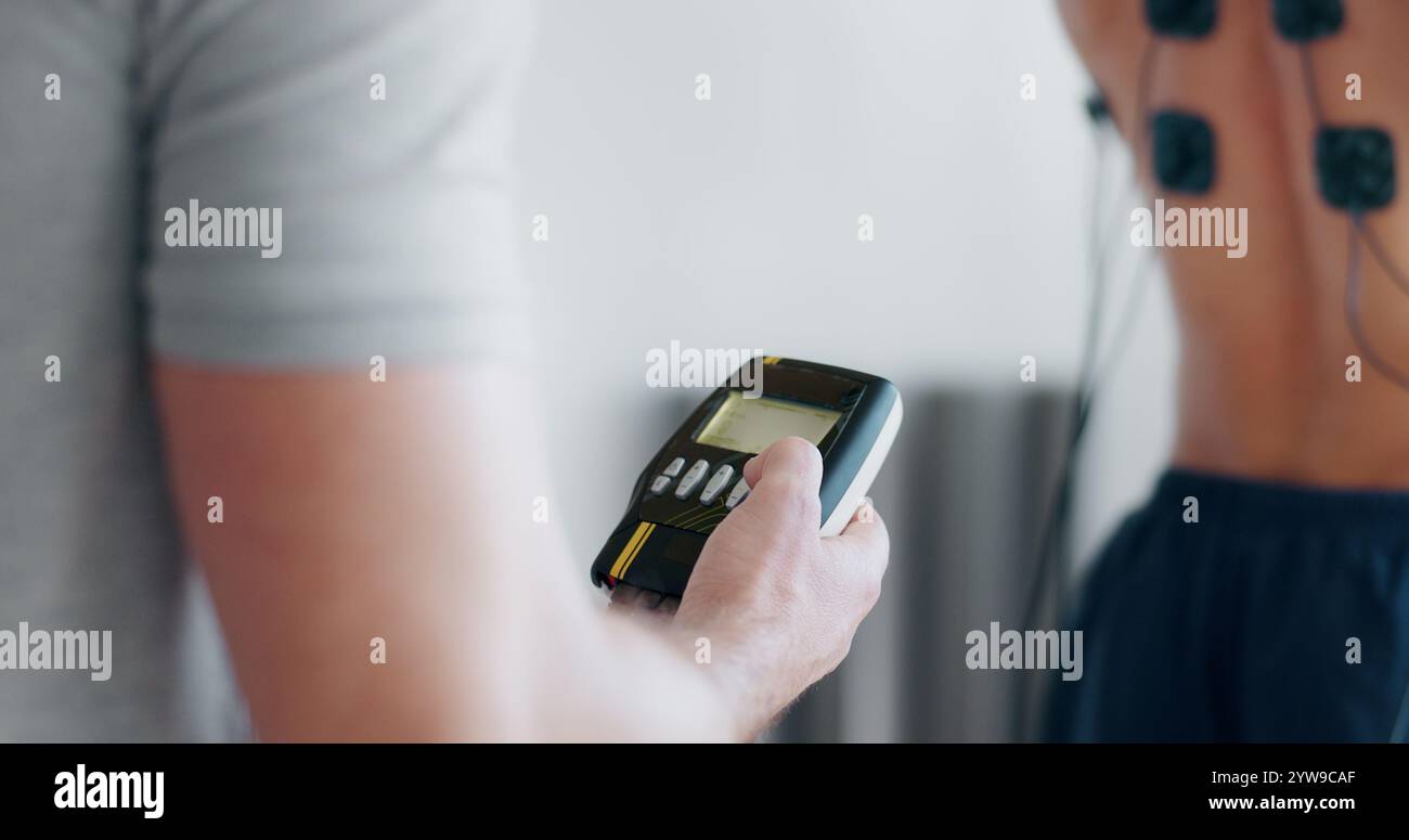 Physiotherapy, emg machine and monitor with hands in clinic for ...