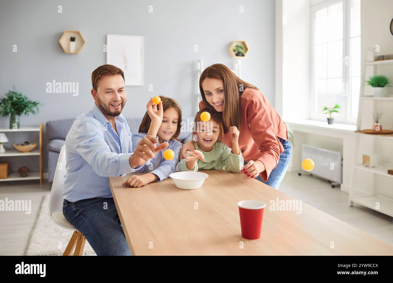 Parents And Children Having Fun Playing A Ball Game Together During ...