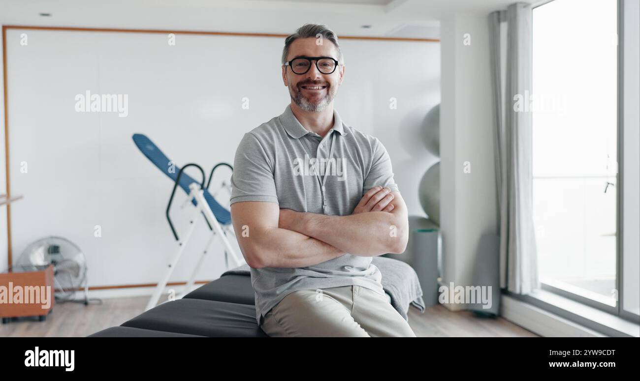 Portrait, happy man and pride as physiotherapist in gym, rehabilitation ...