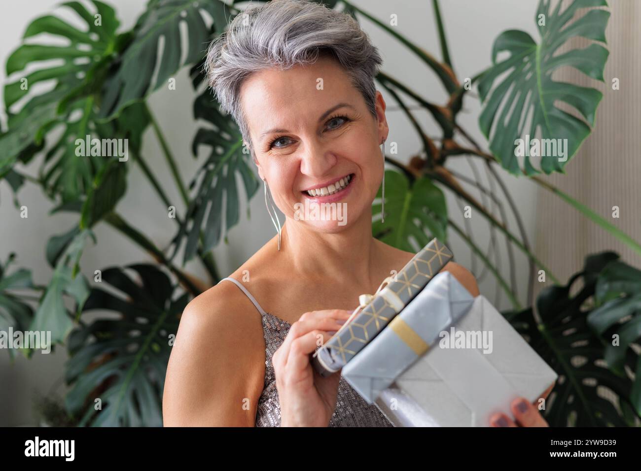 Smiling beautiful happy lady 50 years old with gray hair and short ...