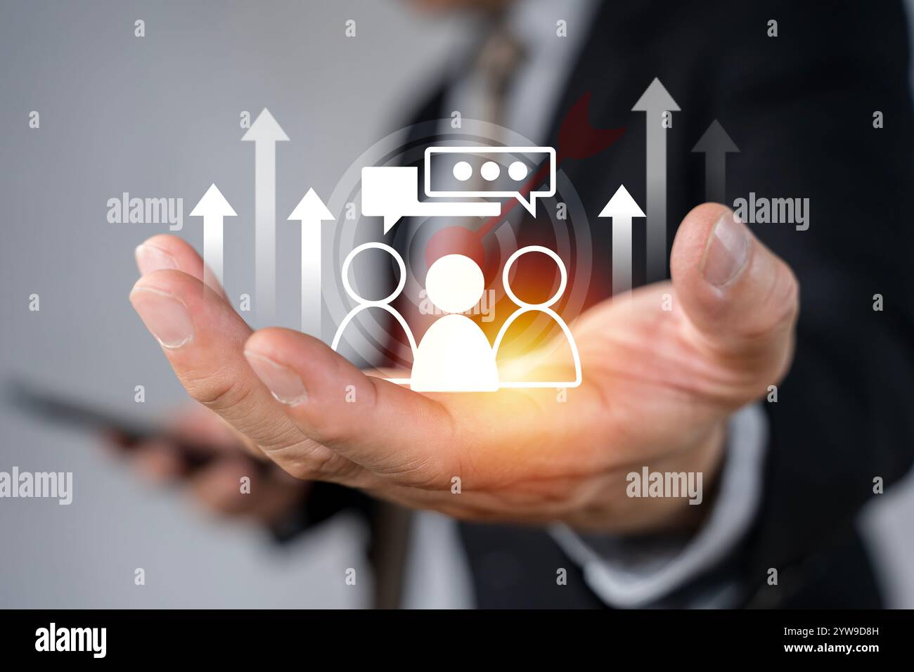 Businessman holding virtual target customer icon for customer focus ...