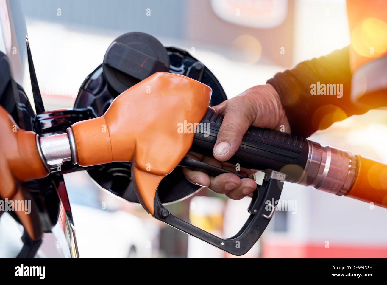 Pumping gas young man woman hi-res stock photography and images - Alamy