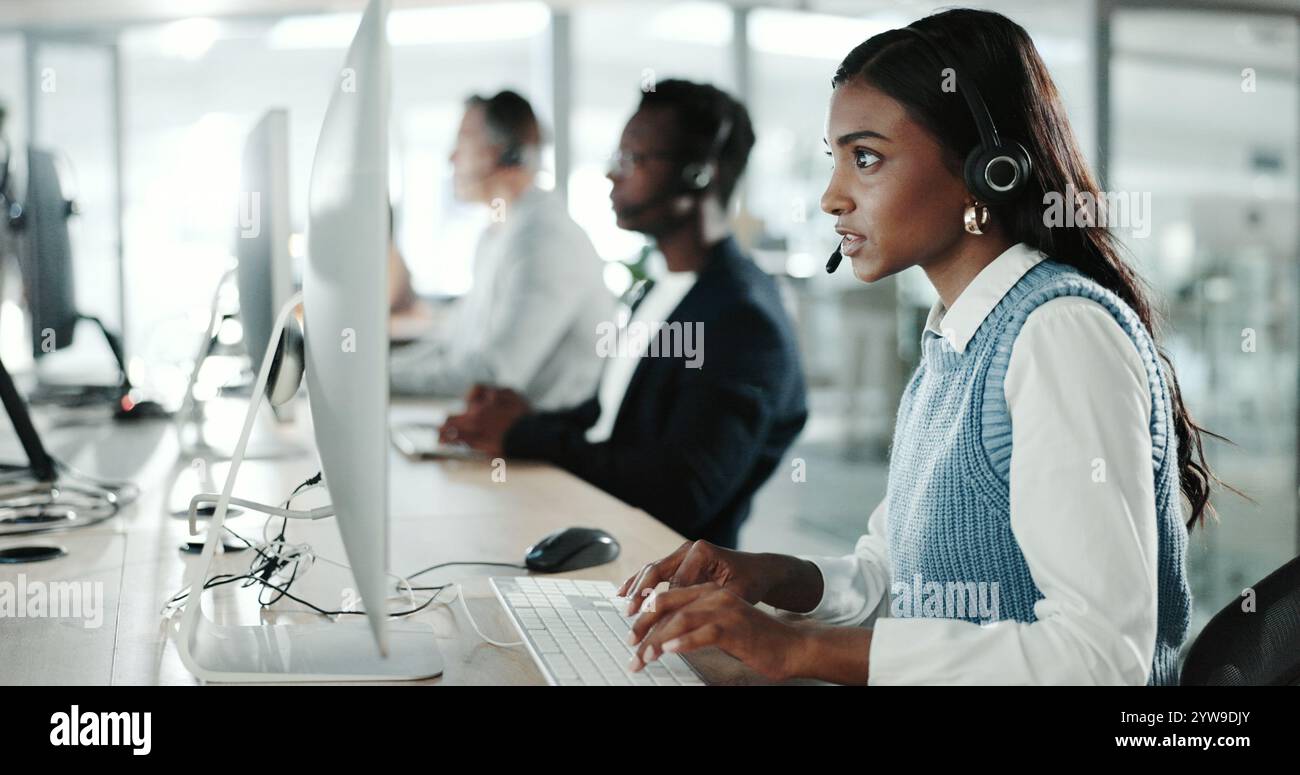 Call center, computer and typing with Indian woman in support office ...