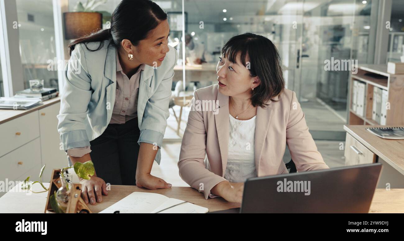 Collaboration, feedback and laptop with business women at desk in ...