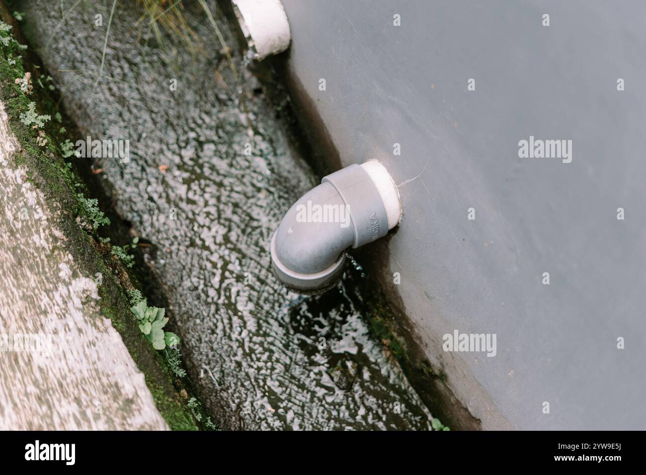 Household wastewater pipe leading from the house to the drainage ditch ...