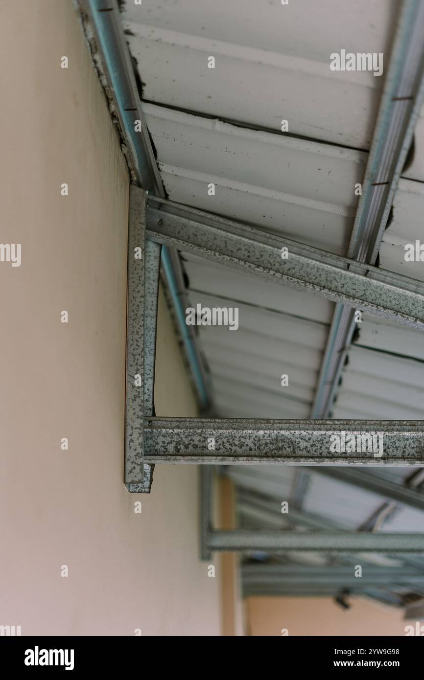 Lightweight steel roof trusses arranged to support roofing tiles ...