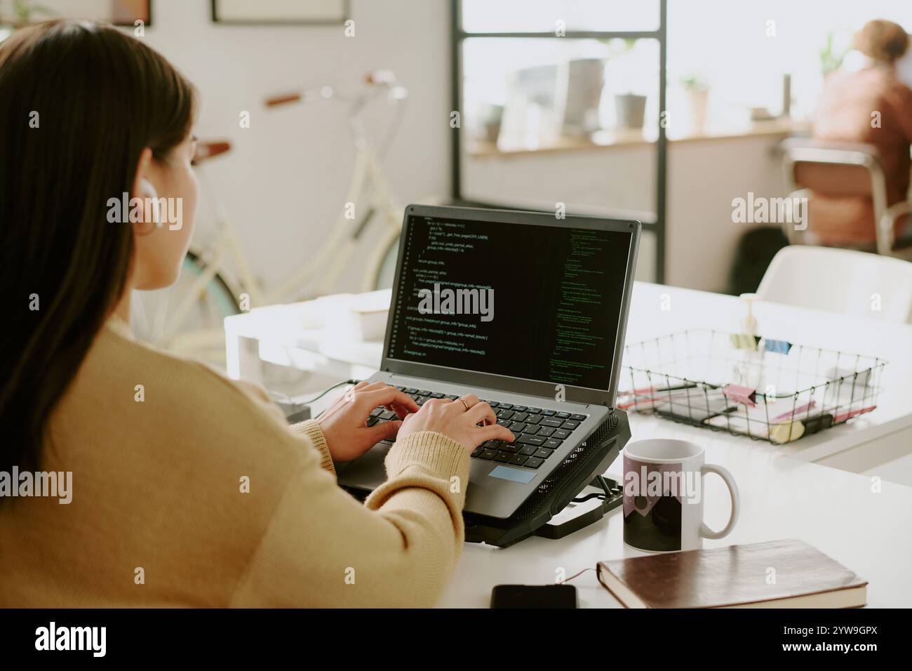 Back view female programmer sitting hi-res stock photography and images ...