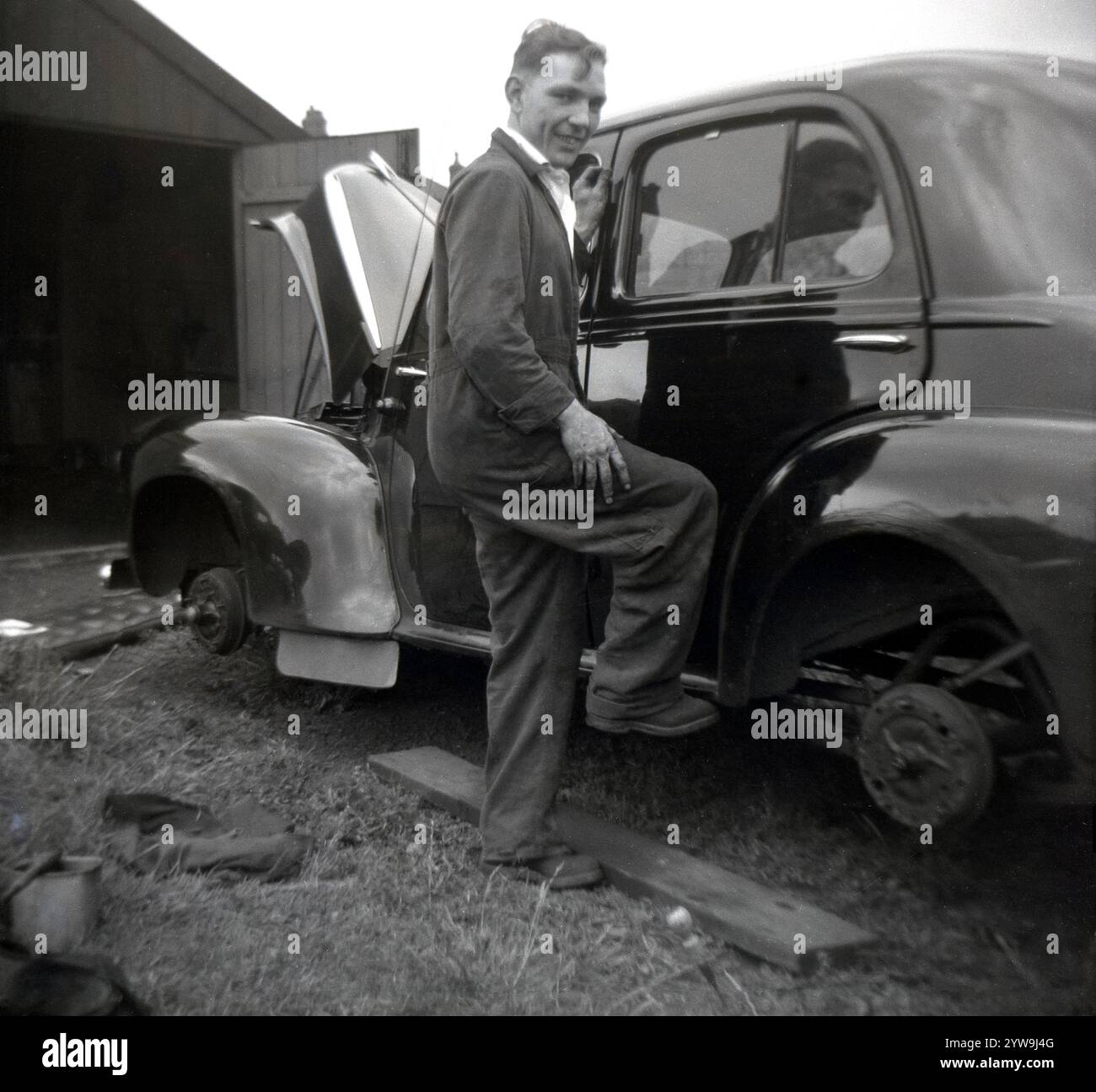 Black mechanic working on car hi-res stock photography and images - Alamy