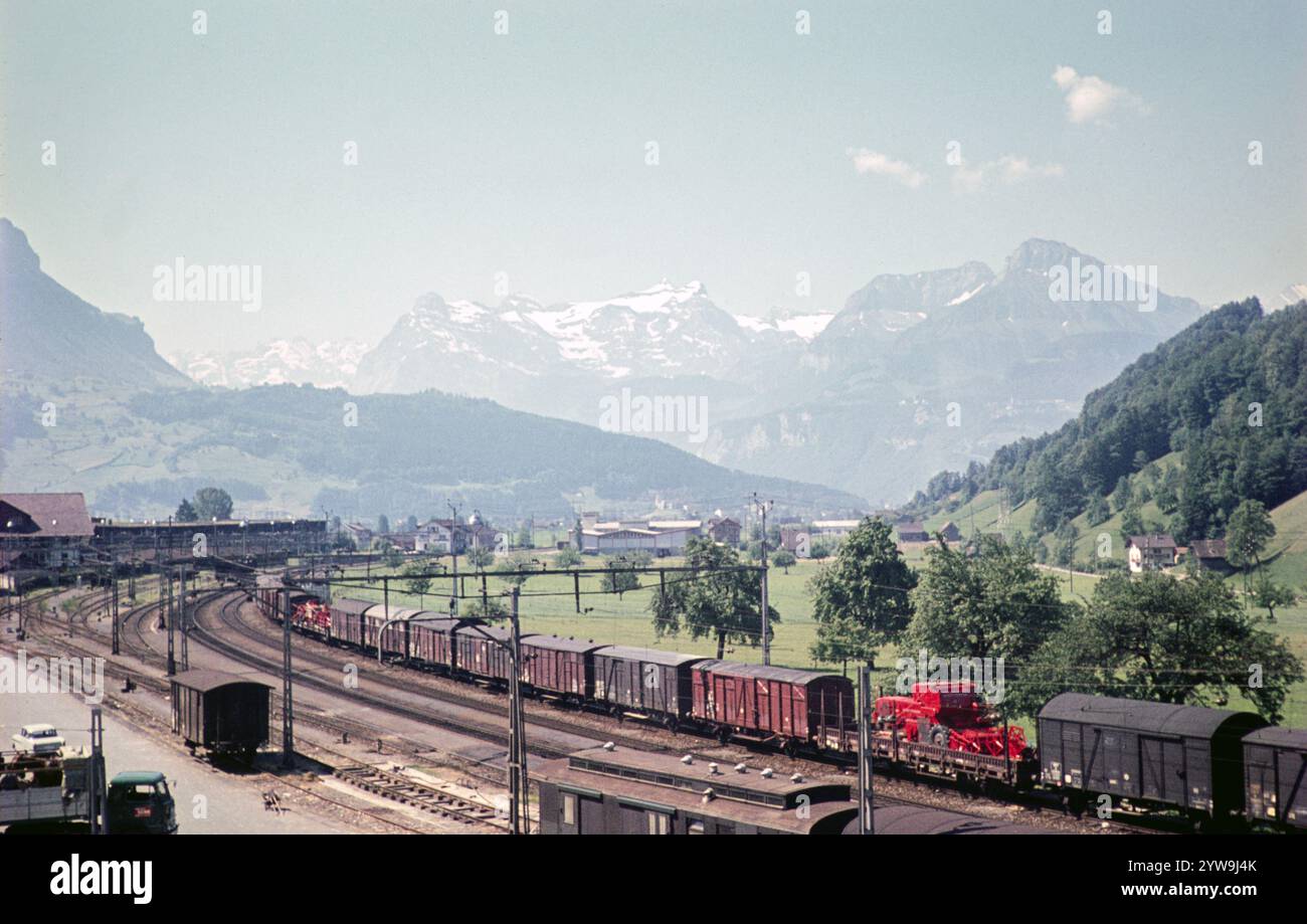 Freight train railway system with view to mountains, thought to be ...