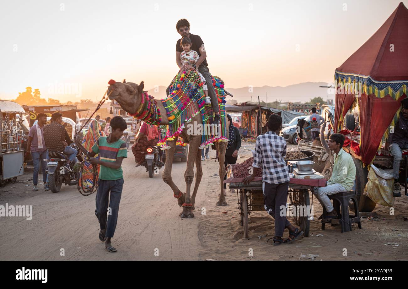 Father son riding camel hi-res stock photography and images - Alamy