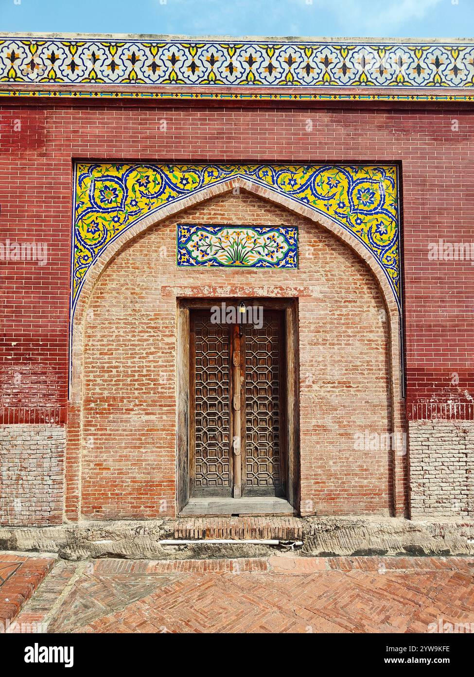 Detailed brick entrance features ornate tile designs, showcasing ...