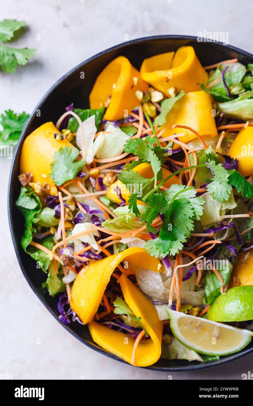 Vietnamese mango salad with nuts and vegetables, top view Stock Photo ...