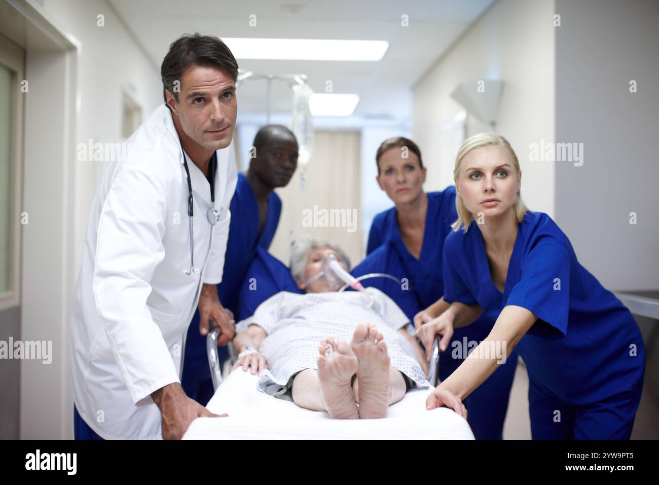 Medical staff moving hospital bed hi-res stock photography and images ...