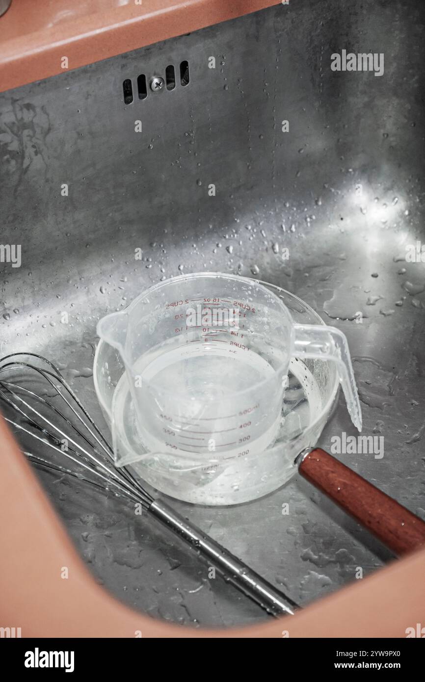 Dirty kitchen utensils inside a kitchen sink Stock Photo - Alamy