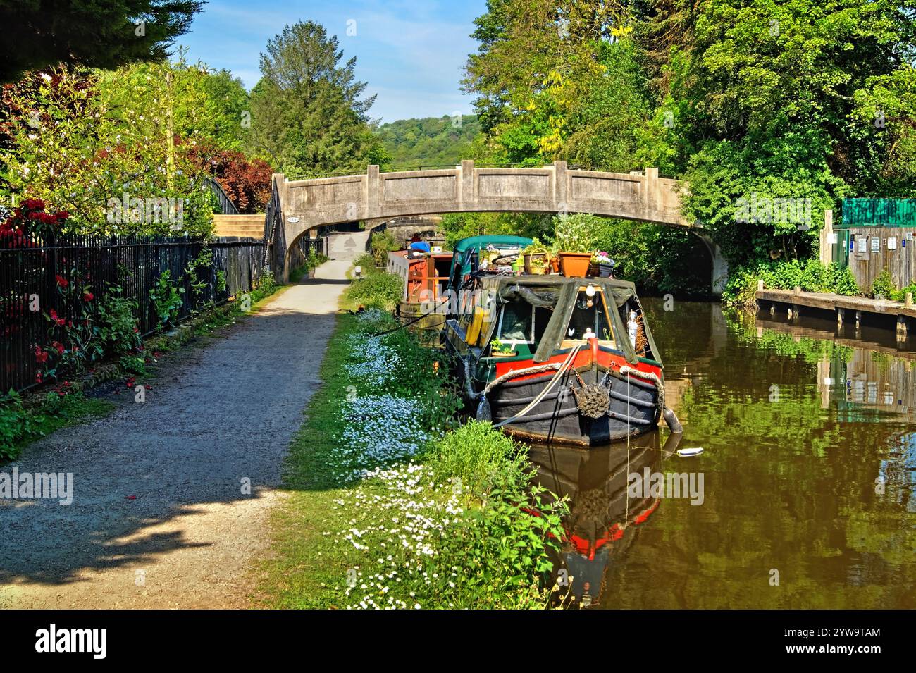 UK, West Yorkshire, Hebden Bridge, Narrowboats and Footbridge over ...