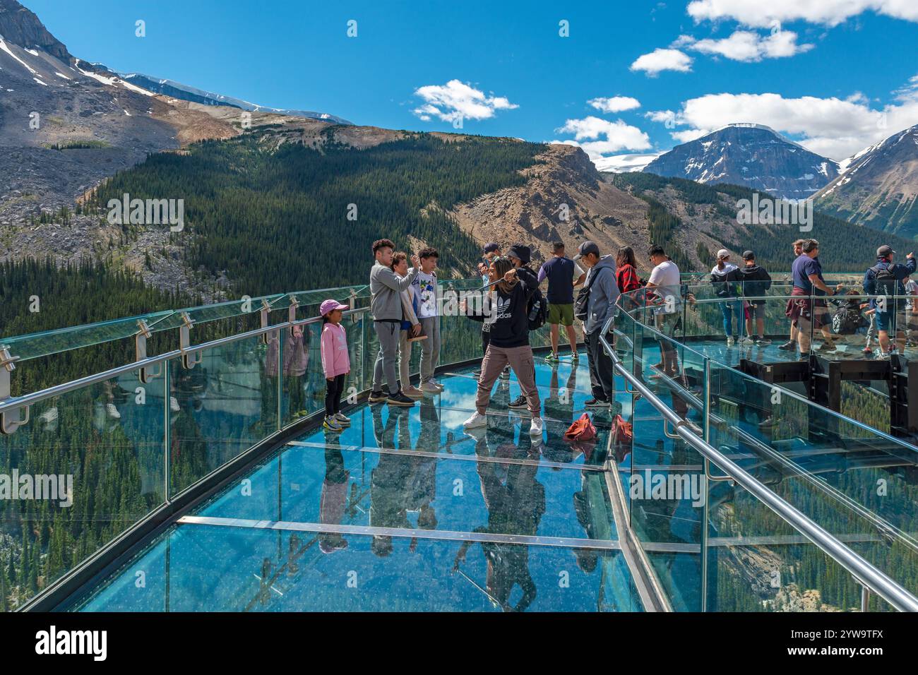 Tourist people on the glass Jasper Skywalk with Canadian Rockies ...