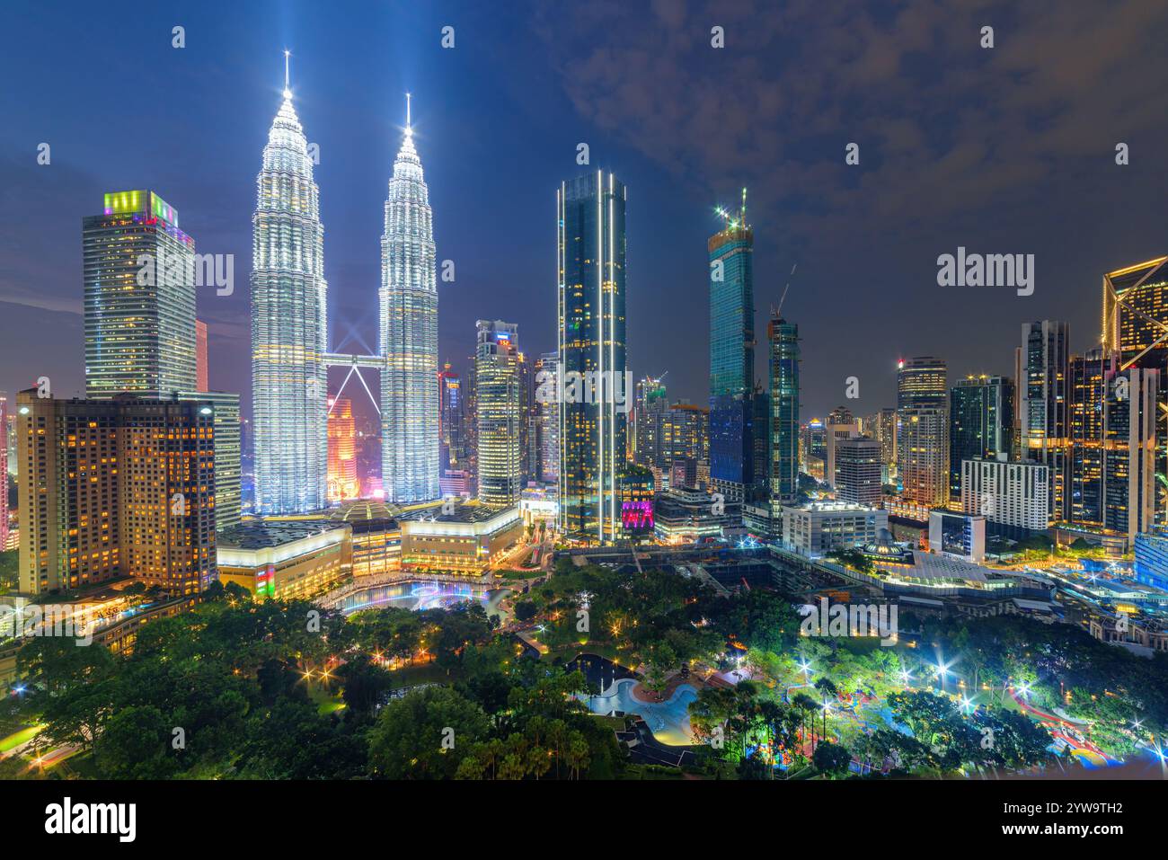 The KLCC Park and the Petronas Twin Towers at night Stock Photo - Alamy