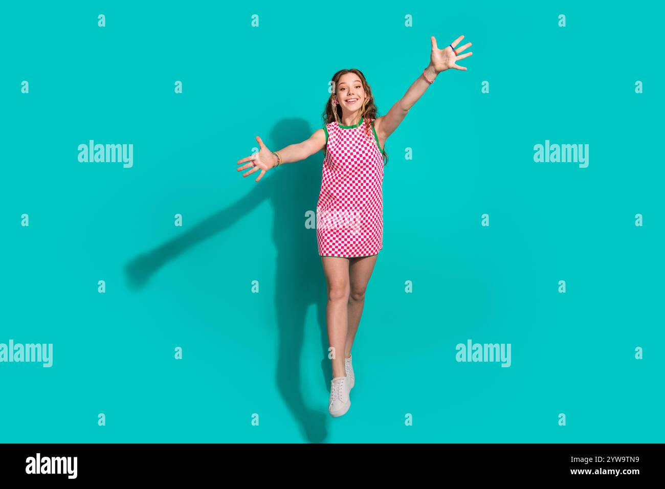Full size photo of pretty teen girl jump stretch hands welcome hug wear ...