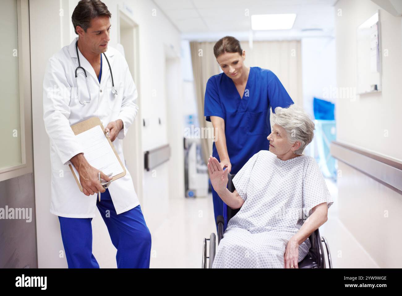 Healthcare, talking and senior woman with doctor, hospital and ...
