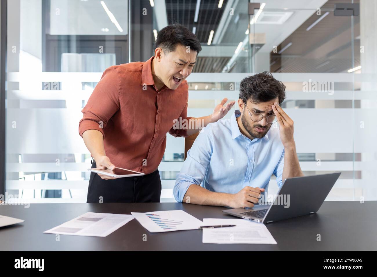 A business scenario depicting an angry boss confronting a stressed ...