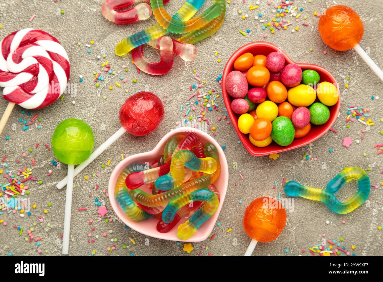 Different types of candies on grey background, copy space. Colorful ...