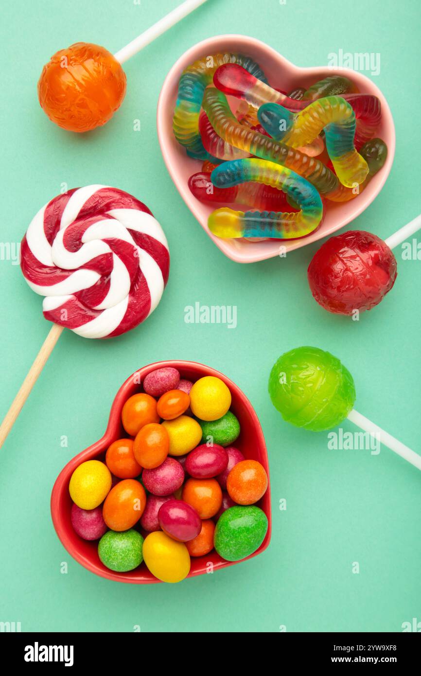 Different types of candies on purple background, copy space. Colorful ...