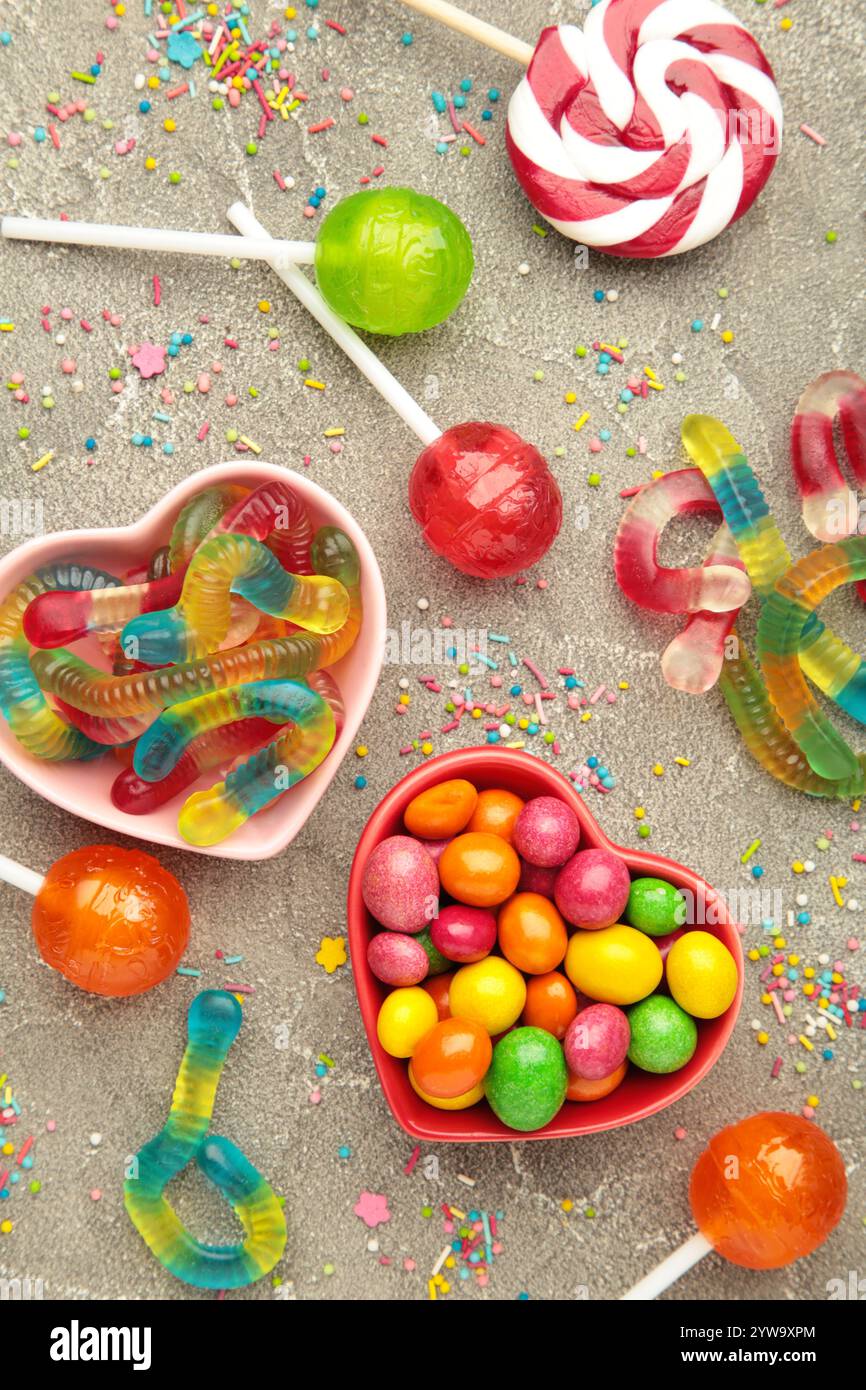 Different types of candies on grey background, copy space. Colorful ...