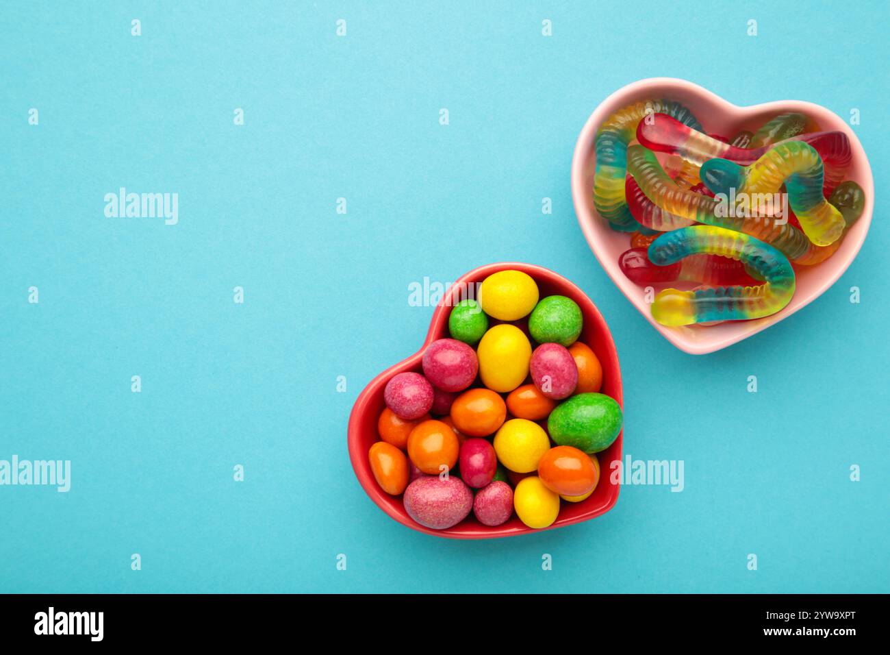 Different types of candies on blue background, copy space. Colorful ...