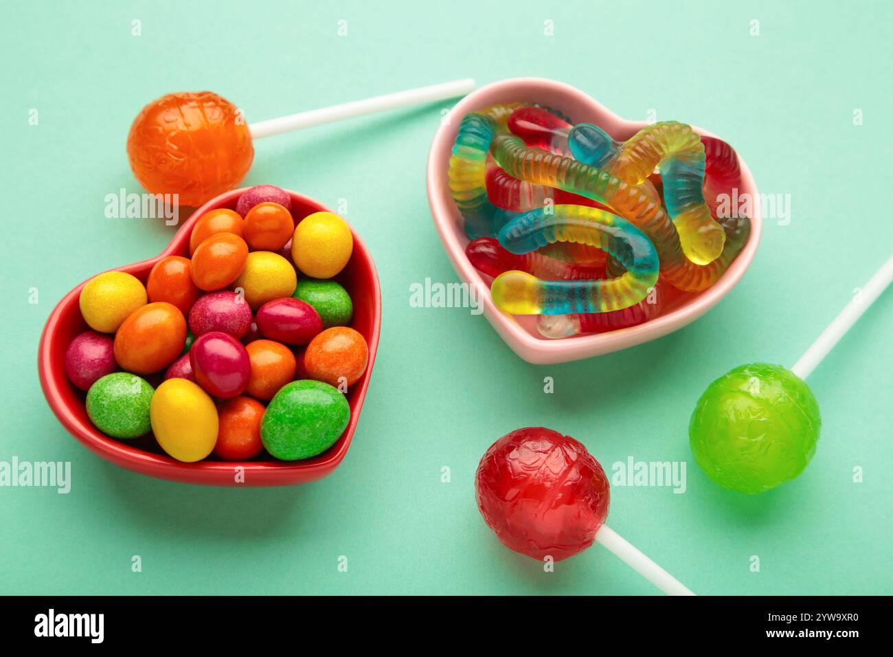 Different types of candies on mint background, copy space. Colorful ...