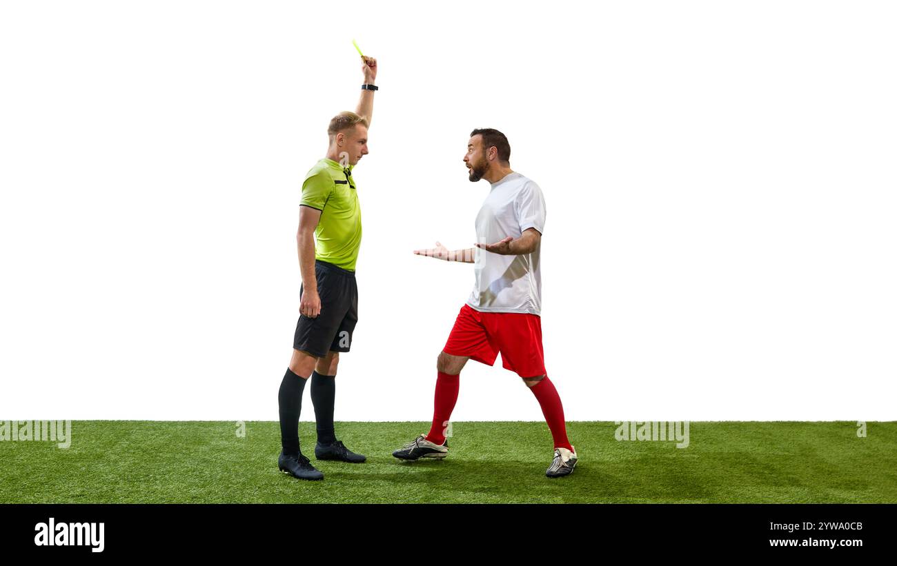 Young referee showing yellow penalty card to emotional man, soccer ...