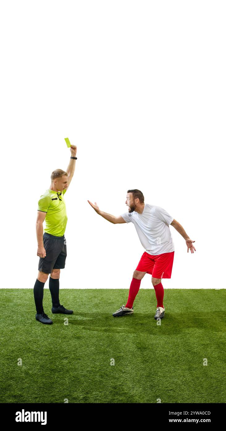 Young man, referee showing yellow penalty card to emotional man, soccer ...