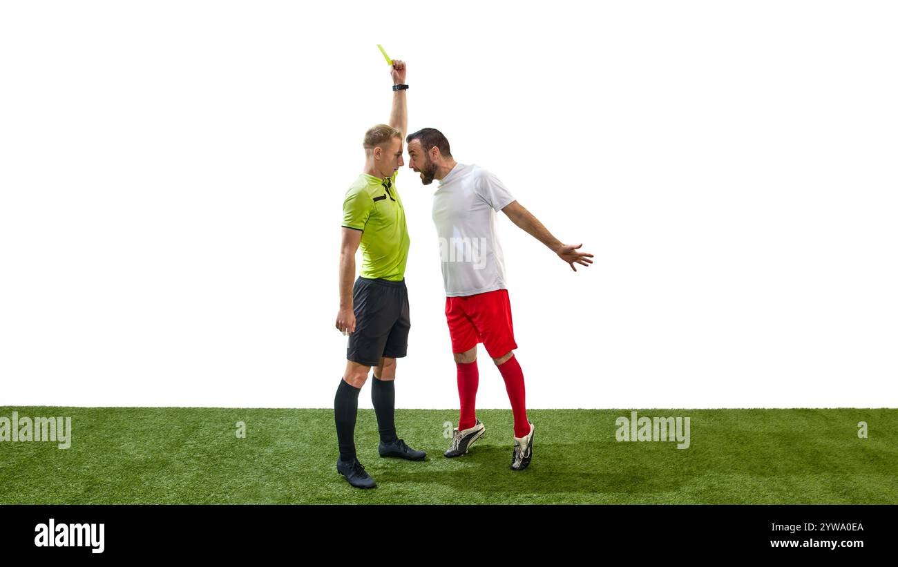 Young focused referee showing yellow card to emotional man, soccer ...