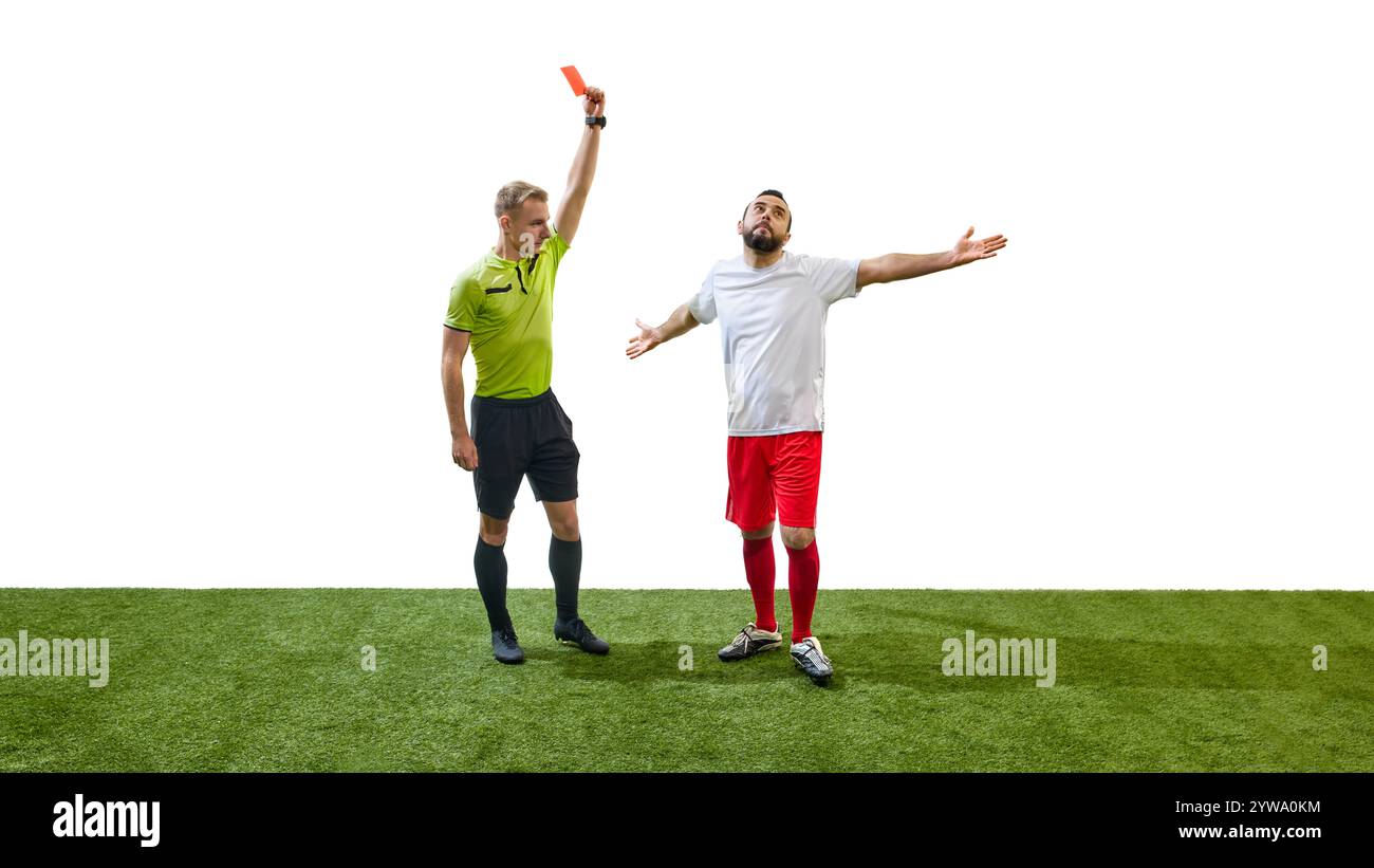 Young man, referee in green jersey, showing red card to man, soccer ...