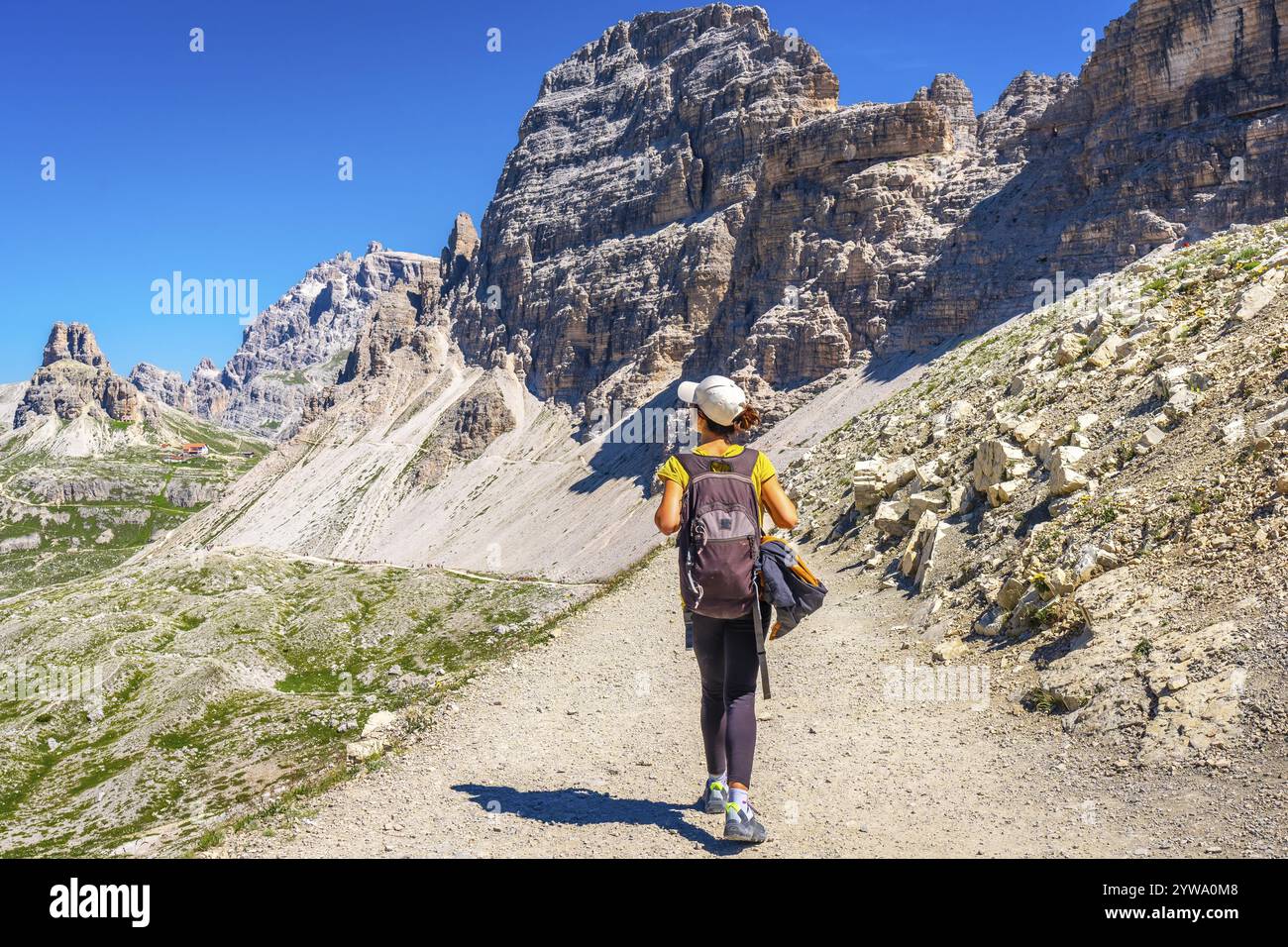 Female hiker enjoying a sunny summer day exploring the breathtaking ...
