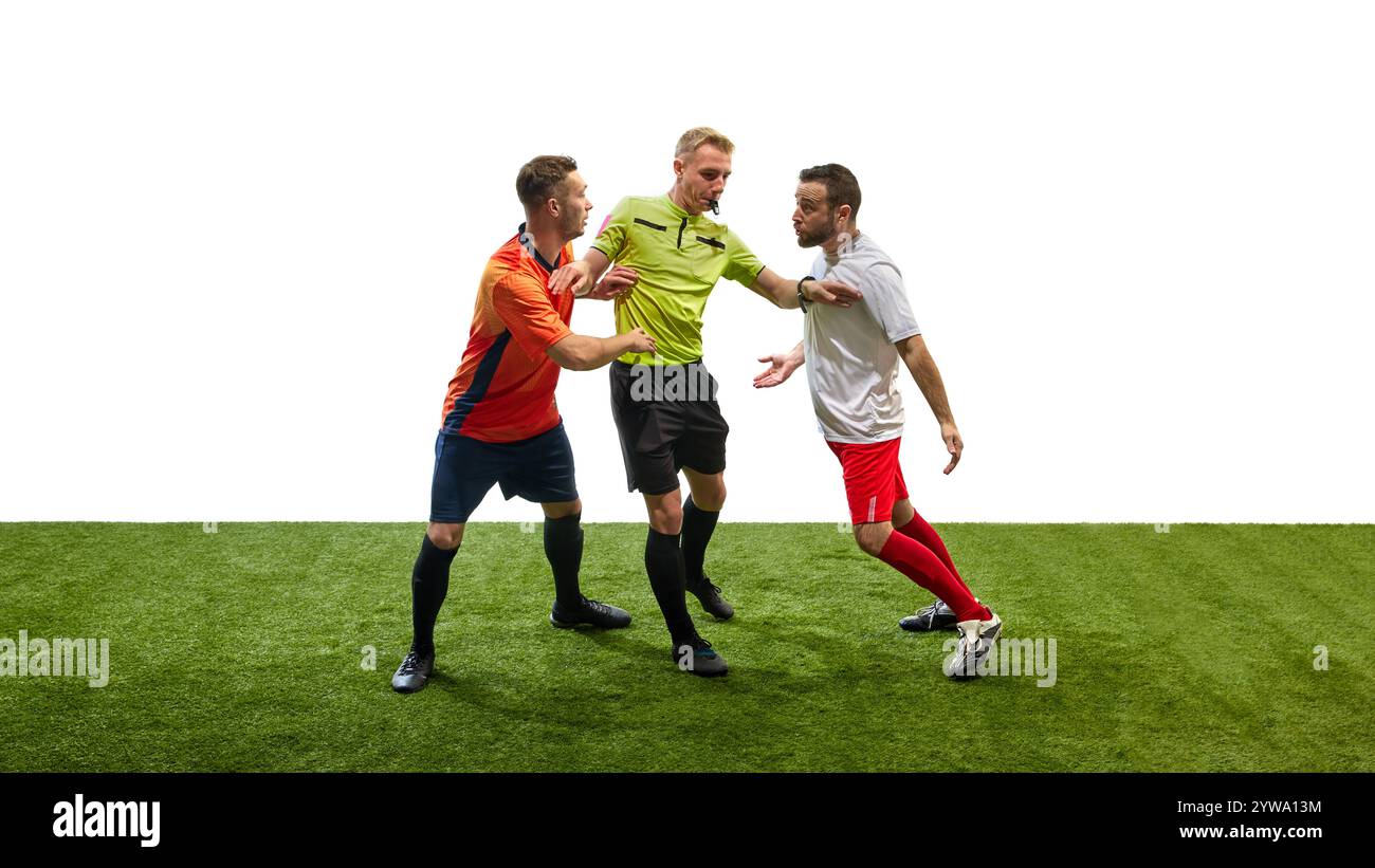 Referee standing and whistling between two players from opposite team ...