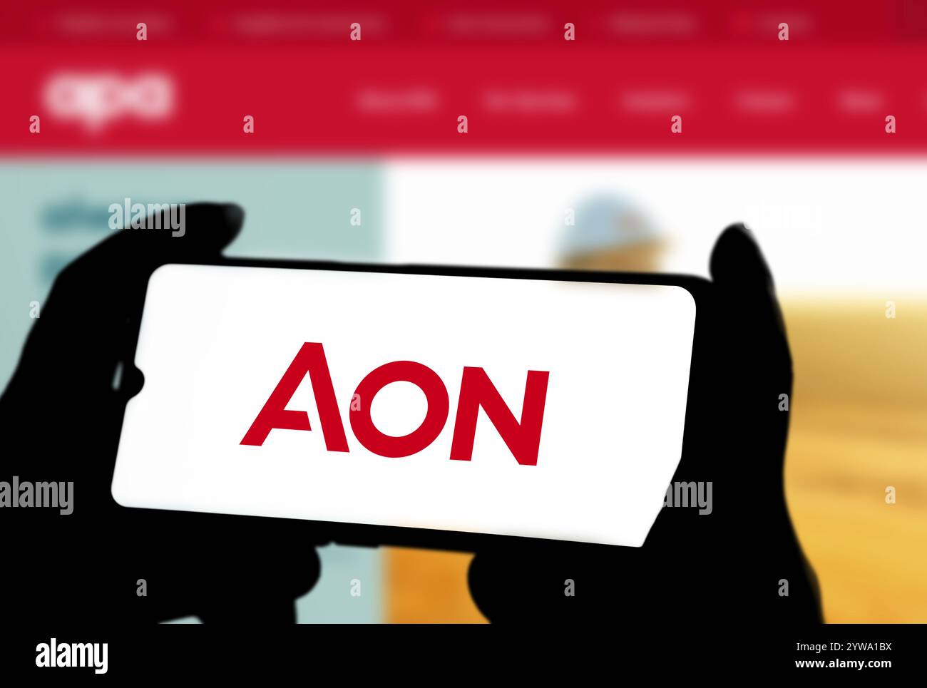 Smartphone displaying logo of Aon PLC, a British multinational professional services firm that ...