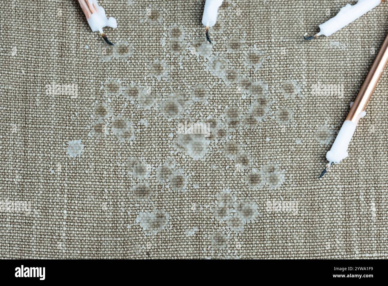 Candle wax remnants on fabric surface after a recent celebration ...