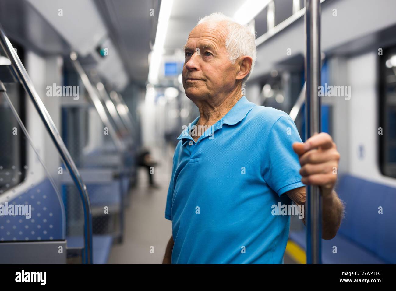 Elderly man in subway train Stock Photo - Alamy