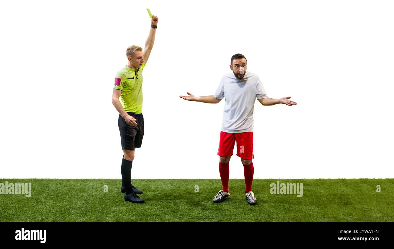 Referee holding yellow card up while player showing confused expression ...